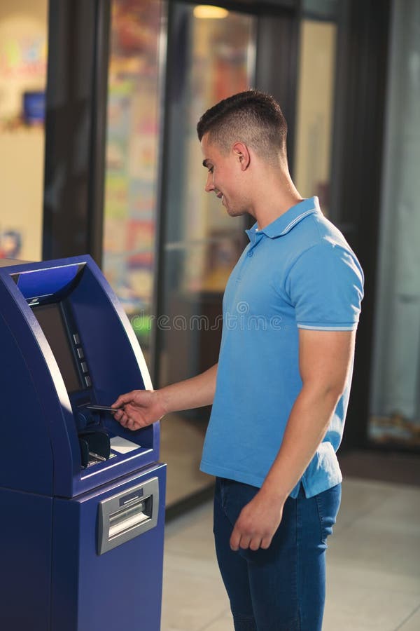 Man Using His Credit Card in an Atm Stock Photo - Image of bank ...