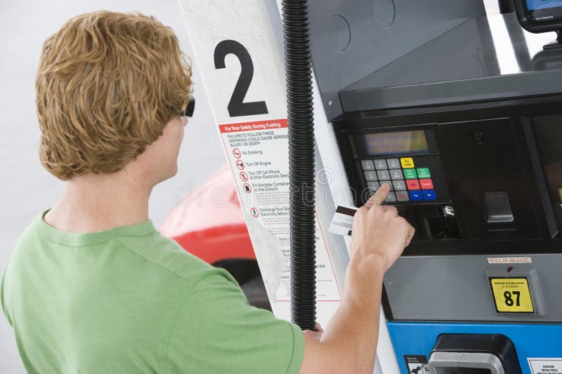 Man Using His Debit Card To Pay for Gasoline at Pump Stock Photo ...