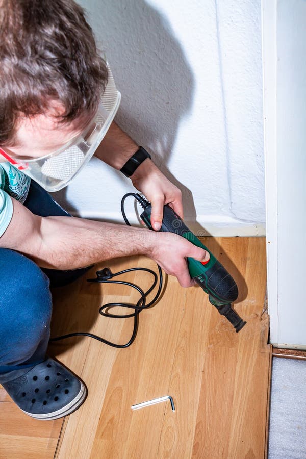 Man Using His Electric Multi Tool on Laminate Stock Image - Image of ...