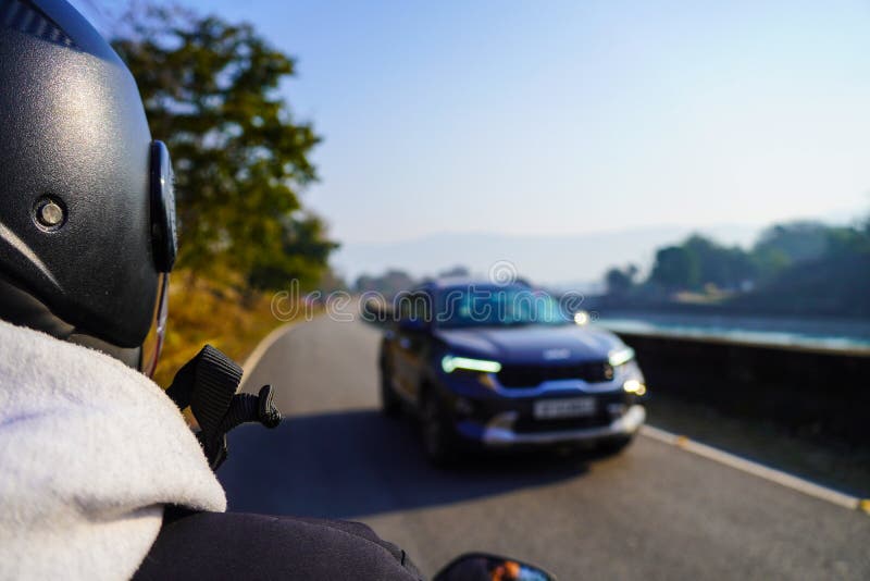 Man is Using His Helmet and Driving, a Man is Driving Using His Bike ...
