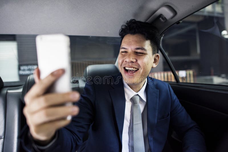 Man using his mobile phone stock image. Image of design - 112447477