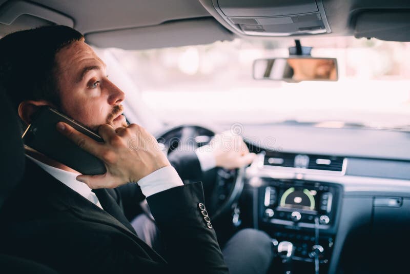 Business Man Using His Phone while Driving the Car Stock Image - Image ...