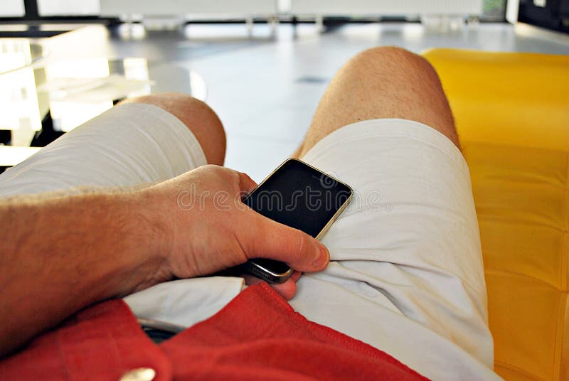 Man using his smartphone stock image. Image of phone - 77015713 Man using his smartphone stock image. Image of phone - 77015713