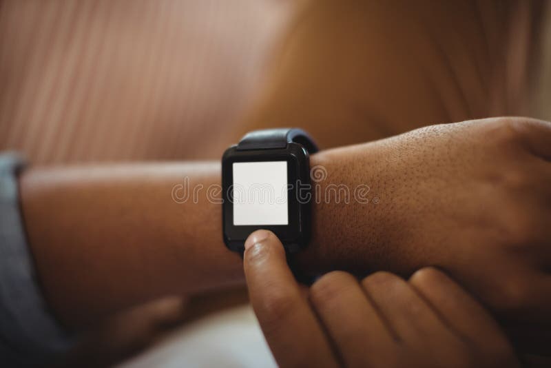 Man using his smartwatch stock image. Image of computing - 87401381