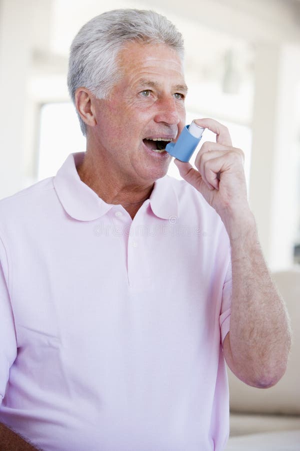 Man Using an Inhaler stock image. Image of asthma, holding - 7772237