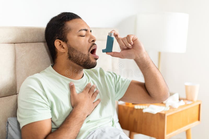 Man Using Inhaler during Asthma Attack Stock Image - Image of black ...