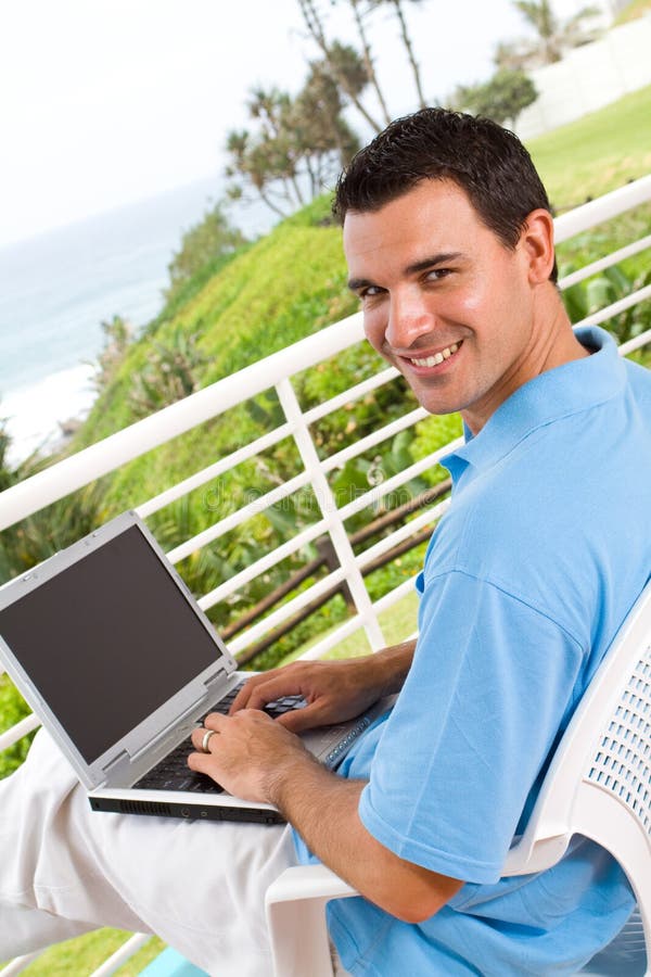 Attractive man with laptop stock photo. Image of computer - 2442520