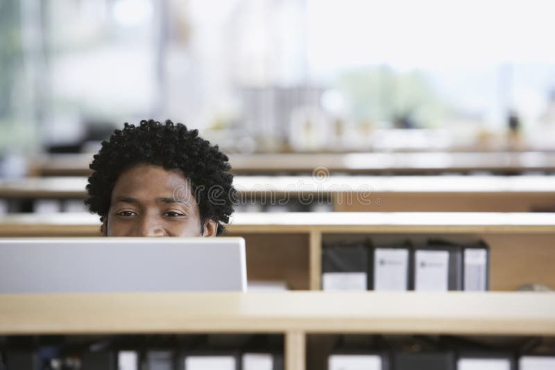 Man Using Laptop Behind Office Desk Stock Image - Image of years ...