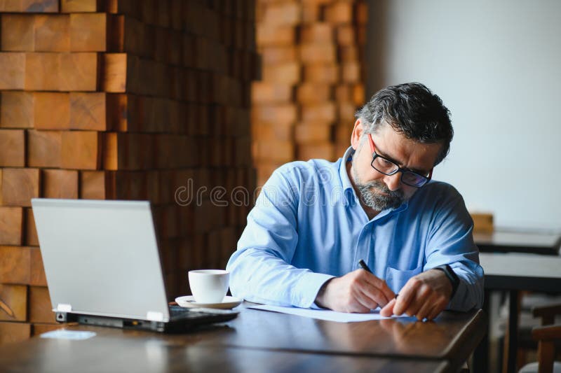 Man Using Laptop in Cafe Bar Stock Photo - Image of looking, office ...