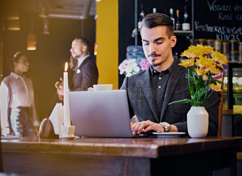 A Man Using Laptop in a Cafe. Stock Photo - Image of mobile, hipster ...