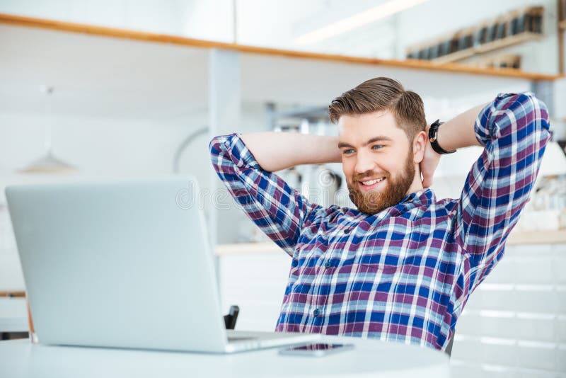 Man Using Laptop Computer in Coffee Shop Stock Image - Image of ...