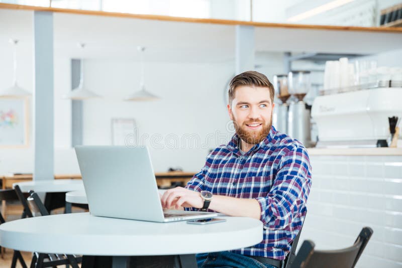 Man Using Laptop Computer in Coffee Shop Stock Photo - Image of adult ...