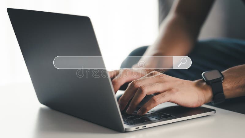 Man Using a Laptop Computer To Searching for Information with the ...