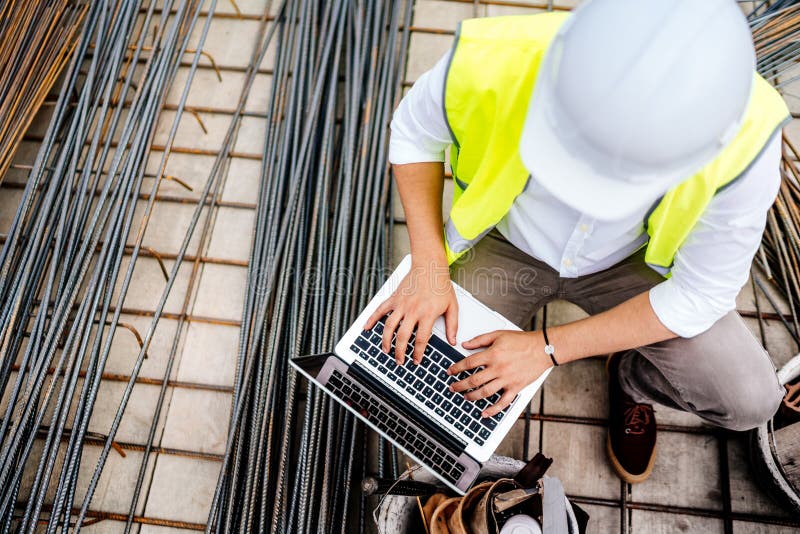 Man Using Laptop on Construction Site. Building Industry Details Stock ...