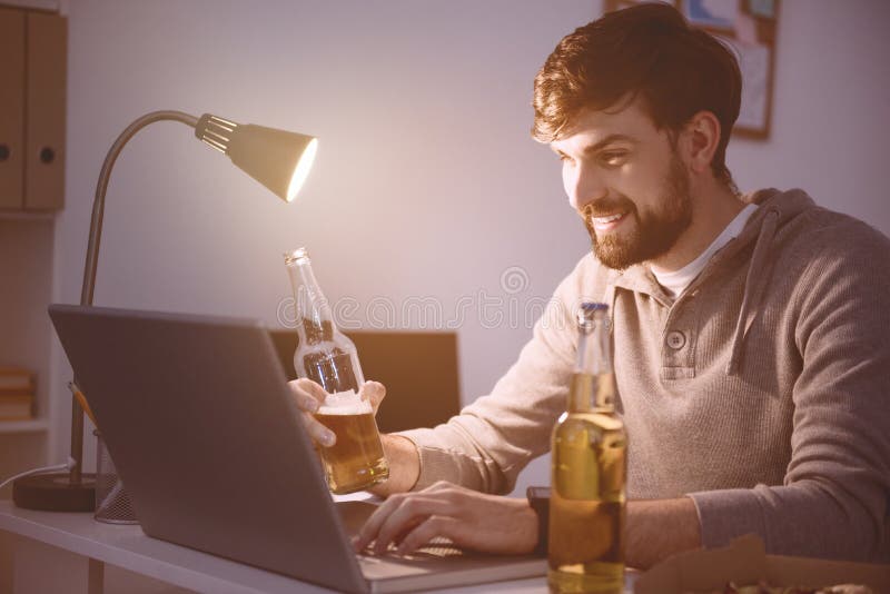 Man Using Laptop and Having a Beverage Stock Photo - Image of home ...