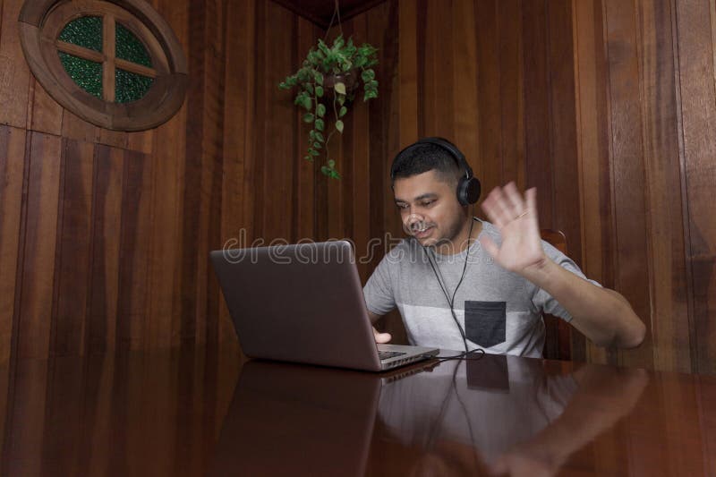 Man Using Laptop with Headset and Making Expressions. Stock Image ...