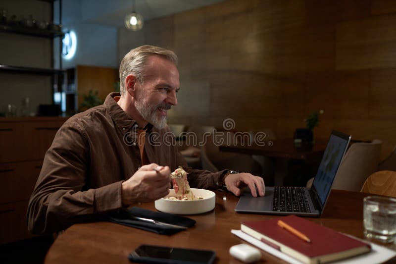 Man Using Laptop during Lunch in Cafe Stock Image - Image of meal ...