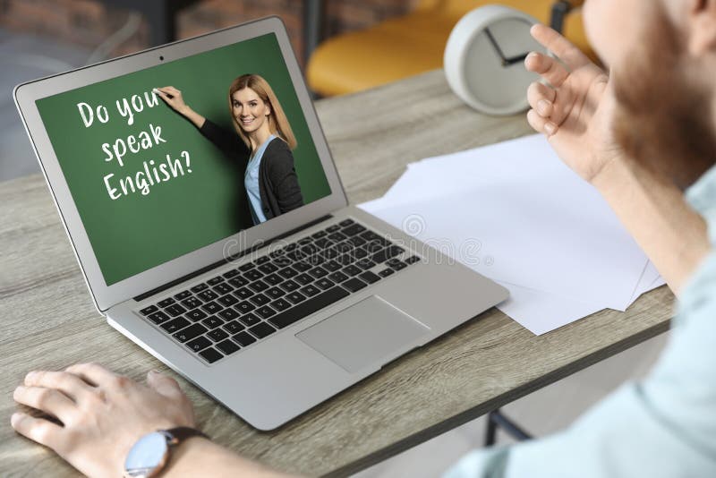 Man Using Laptop for Online English Learning with Teacher at Home Stock ...
