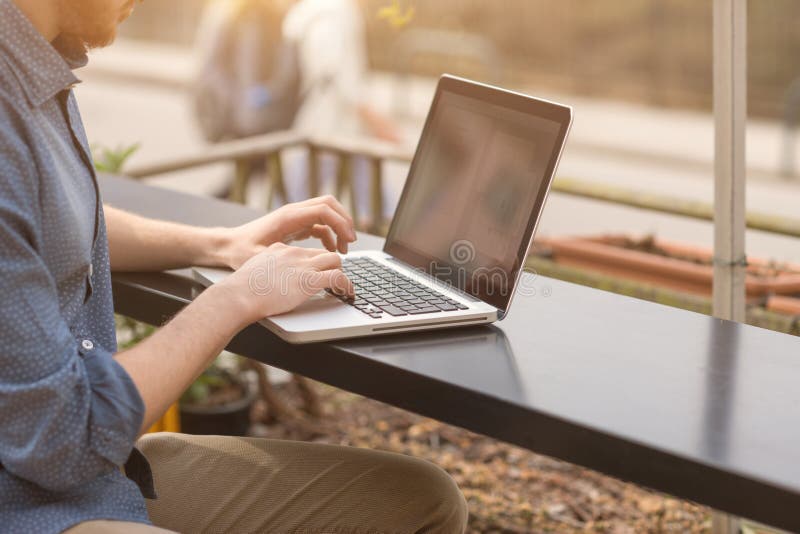 Man Using a Laptop on an Outdoor Table Stock Photo - Image of internet ...