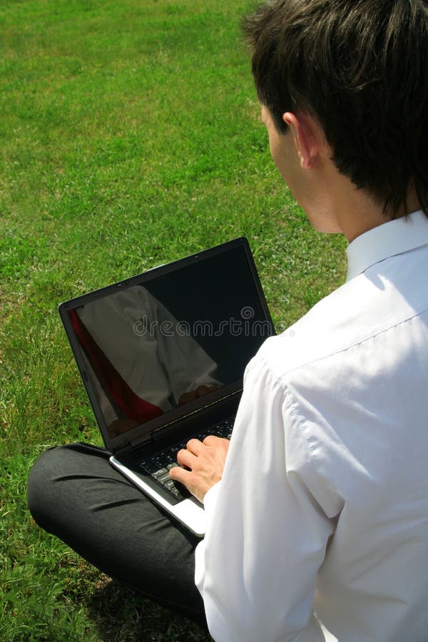 Man using laptop outdoors stock image. Image of suit, wireless - 2591979