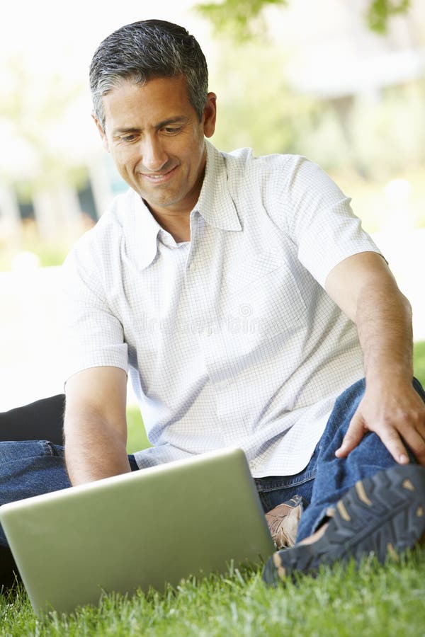 Man using laptop outdoors stock image. Image of social - 55894275