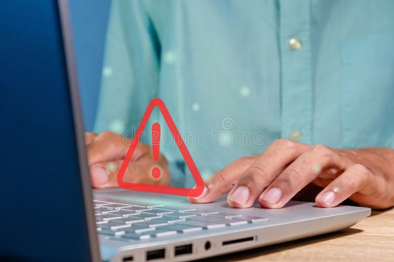 Man Using a Laptop with Red Triangle Caution Warning Sign for ...