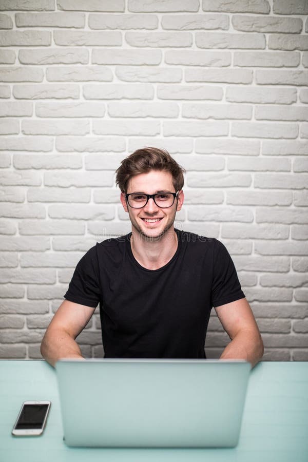 Man Using Laptop while Sitting at His Modern Coworking Place Concept of ...