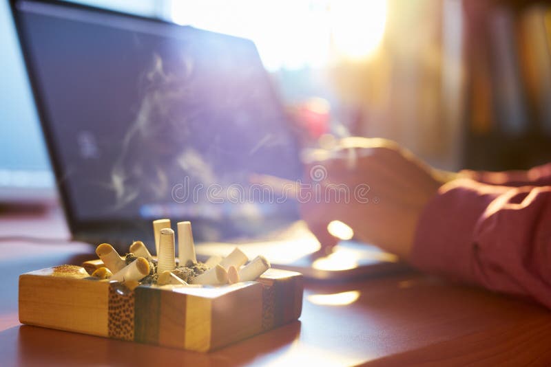 Man Using Laptop And Smoking Cigarette In Office Stock Photo - Image of ...