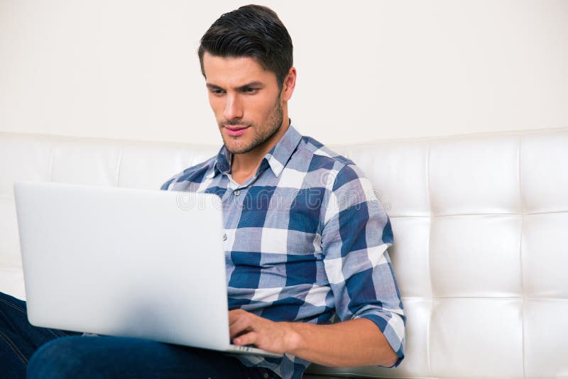Man Using Laptop on the Sofa Stock Photo - Image of sitting, laptop ...