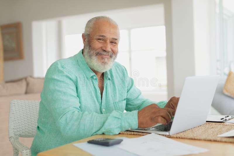 Man Using Laptop on a Table Stock Image - Image of paper, house: 152802889