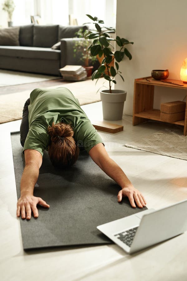 Man Using Laptop To Do Exercise Online Stock Photo - Image of laptop ...