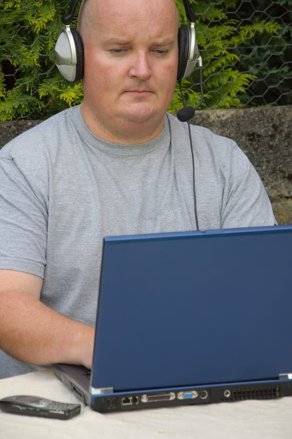 Man using laptop and voip stock image. Image of human - 10427577