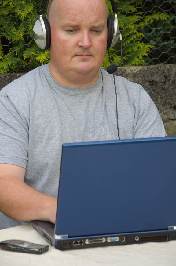 Man using laptop and voip stock image. Image of human - 10427577