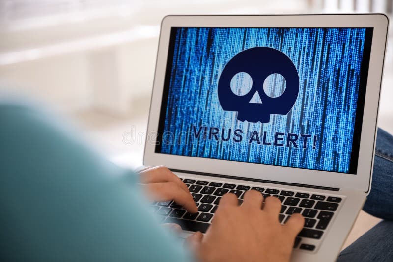 Man Using Laptop with Warning about Virus Attack on Screen at Home ...