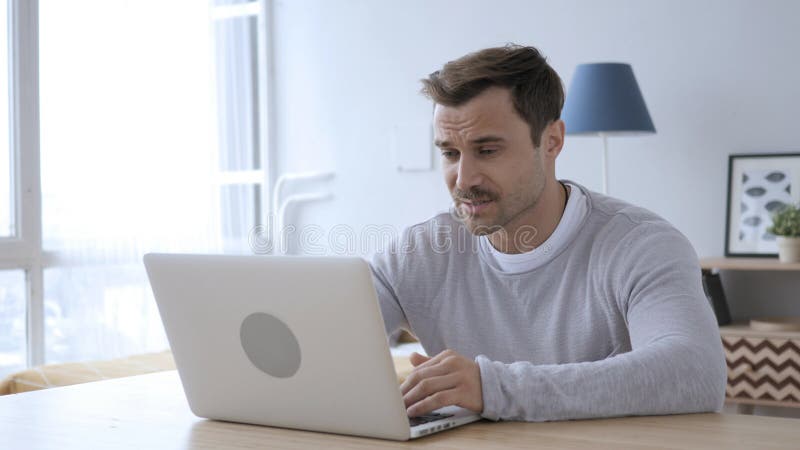 Man Using Laptop at Work stock image. Image of posture - 123051975