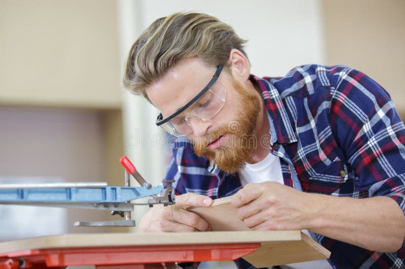 Man Using Machine To Cut Wood Stock Photo - Image of metal, plant ...