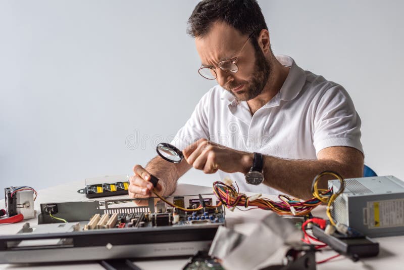 Man Using Magnifier while Holding Wires Stock Image - Image of ...