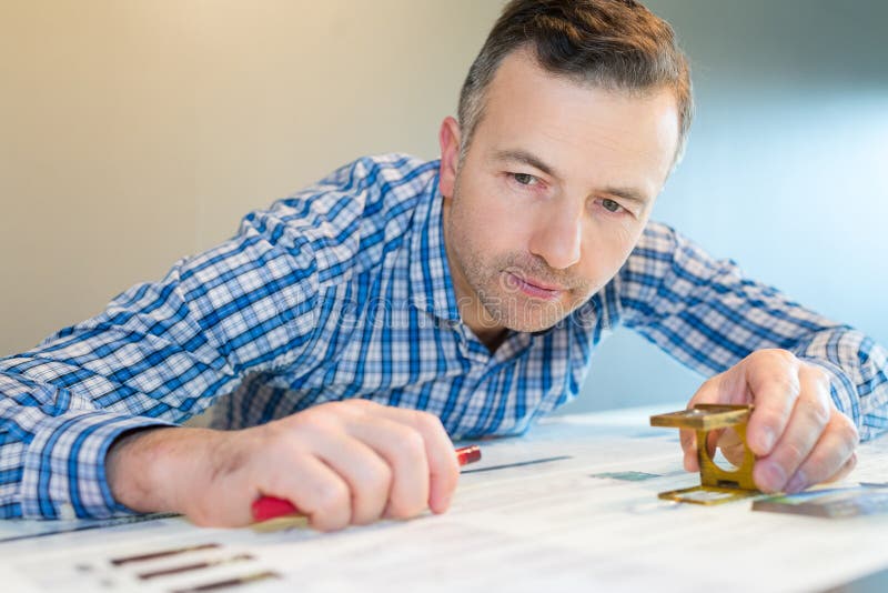 Man Using Magnifying Device To Check Printed Copy Stock Image - Image ...