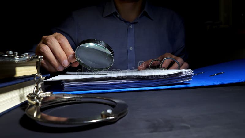 Man Using Magnifying Glass for Check Business Documents for ...
