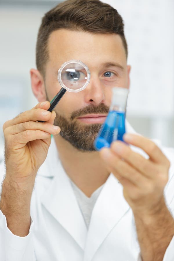 Man Using Magnifying Glass in Lab Stock Photo - Image of scientific ...