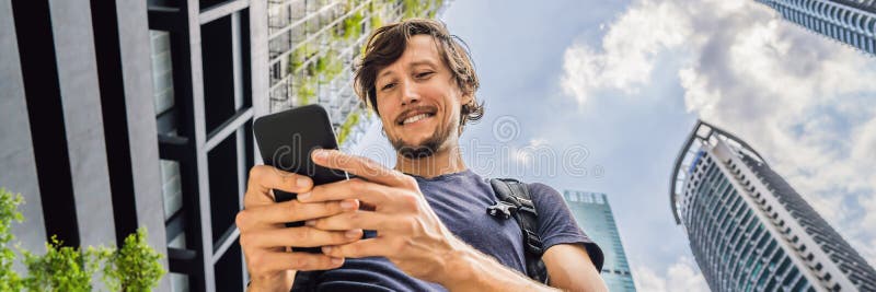 Man Using Map App on Smartphone on the Background of Skyscrapers BANNER ...