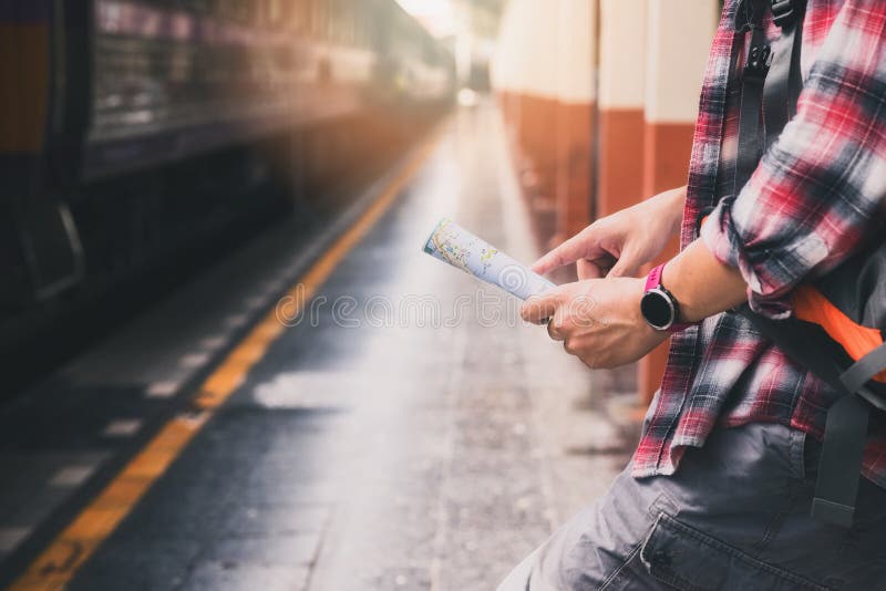 A Man Using Map To Travel at Train Station. Travel Concept Stock Photo ...