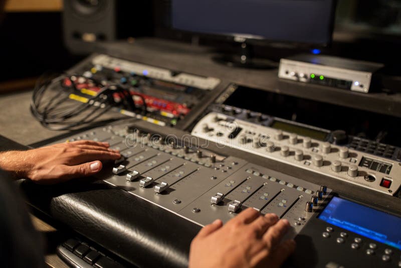 Man Using Mixing Console in Music Recording Studio Stock Photo - Image ...