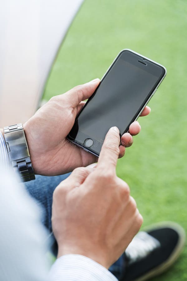 Man using mobile phone stock photo. Image of holding - 183362502