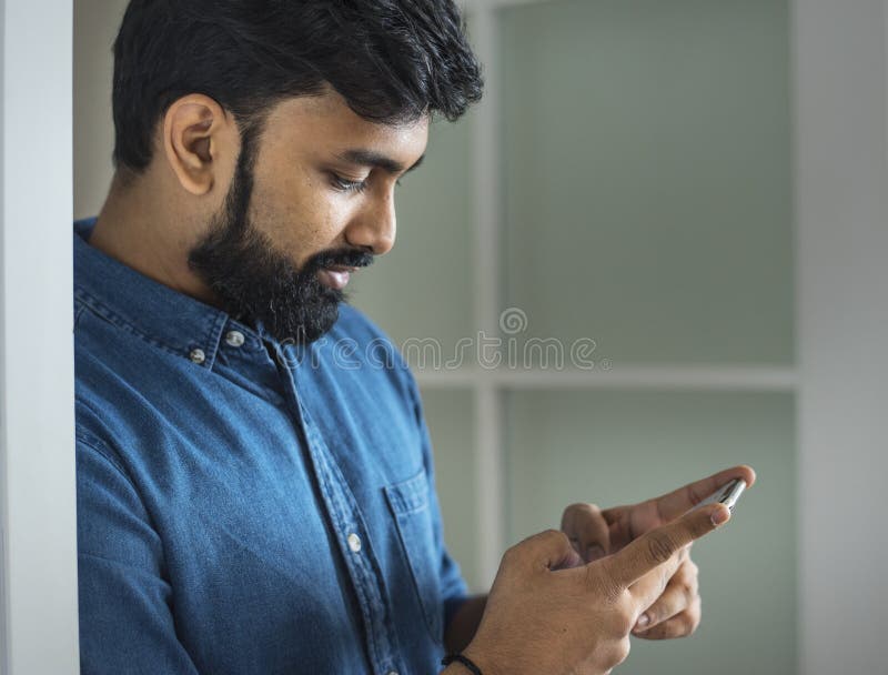 Man Using Mobile Phone Sitting on Couch Stock Photo - Image of asian ...