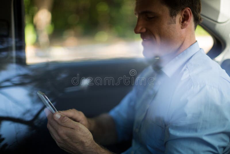 Man Using Mobile Phone in Car Stock Image - Image of adult, mobile ...