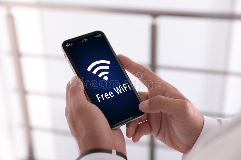 Man Using Mobile Phone Connected To WiFi Indoors, Closeup Stock Photo ...