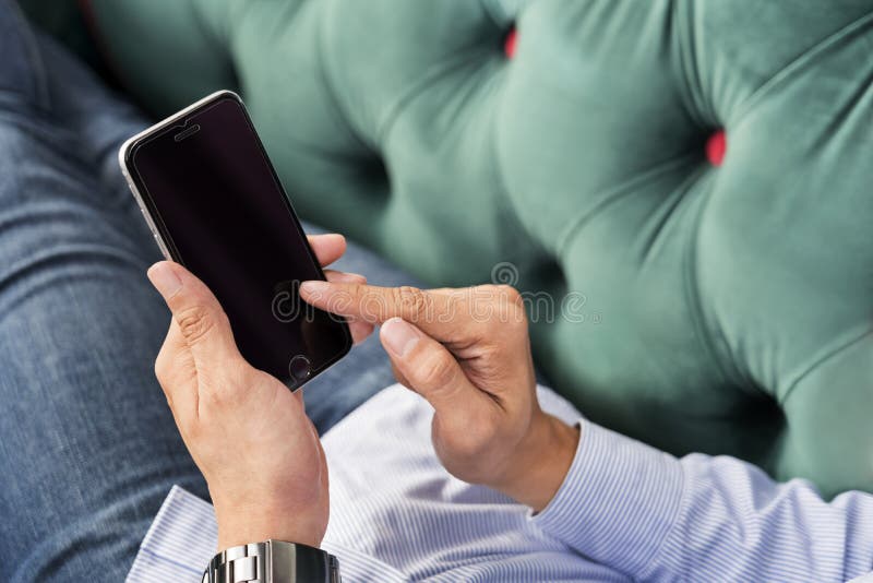 Man Using Mobile Phone on a Couch Stock Photo - Image of wireless ...