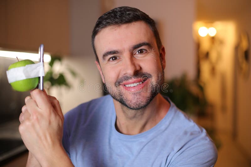 Man Using a Mobile Phone that Has a Fruit Attached To it Stock Image ...