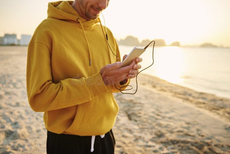 Man Using Mobile Phone during Jogging Stock Photo - Image of horizontal ...